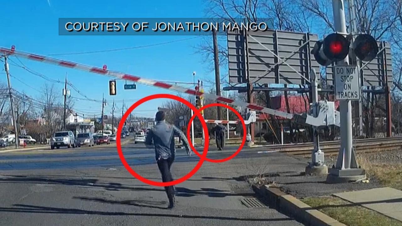 Exclusive: Man Saves Senior from Oncoming Train! - YouTube