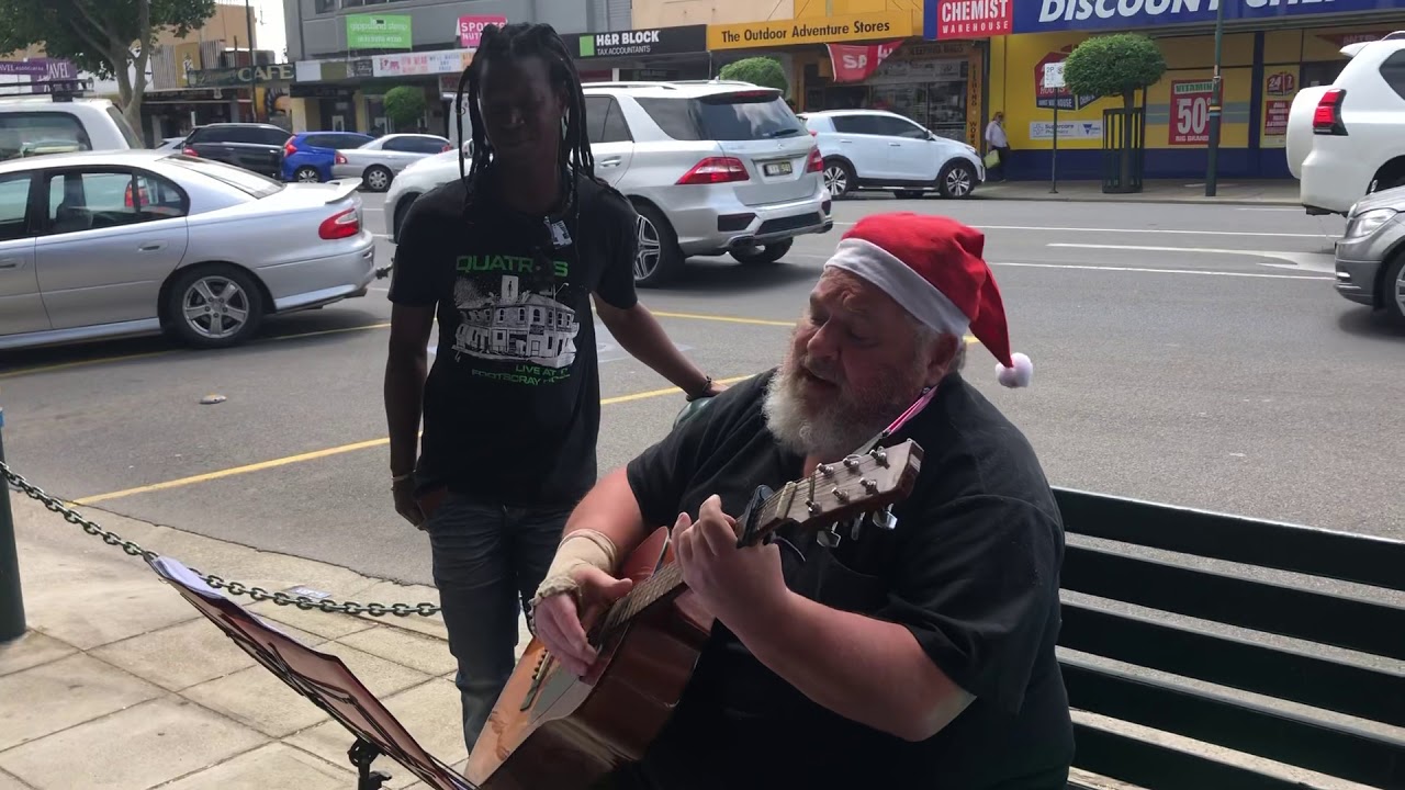 Peter, Connell my friend, performing a Beatles song, in the street ...