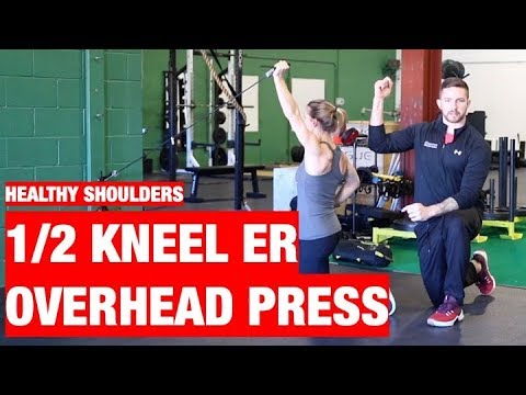How To Perform The 1/2 Kneel Band External Rotation Overhead Press ...