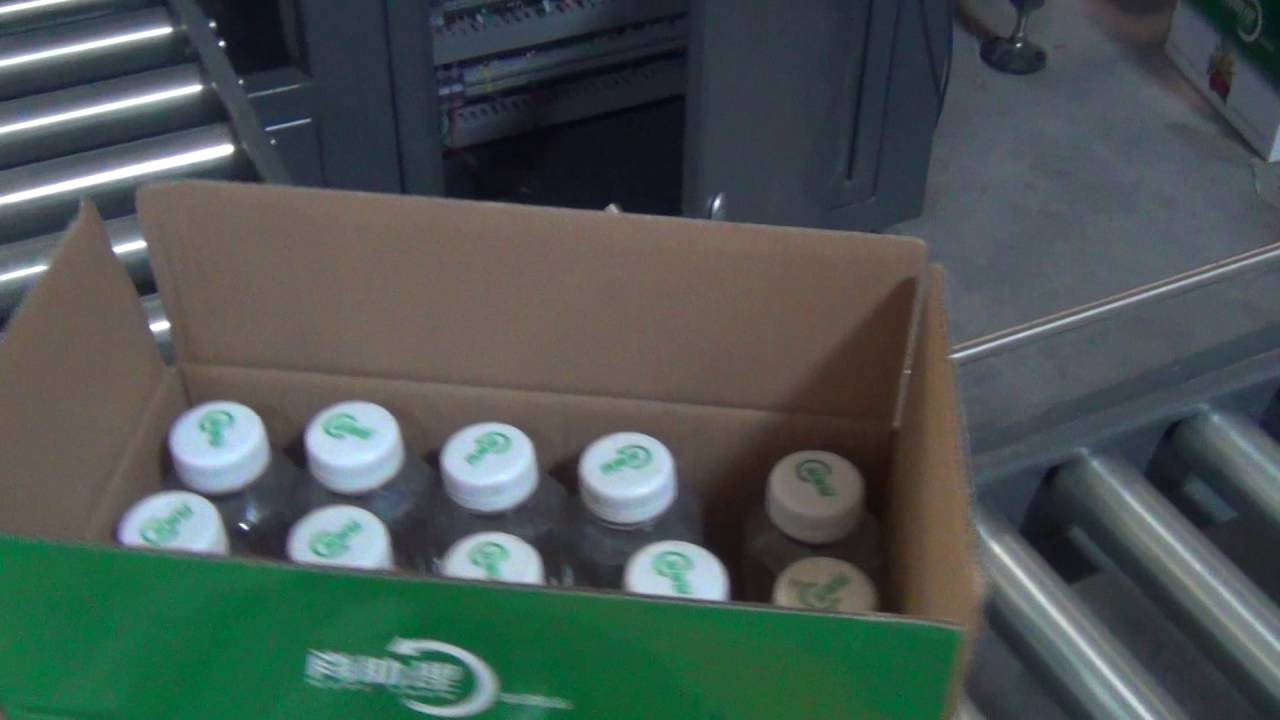 Drop Type Case Packing Machine For Mineral Water(Round Bottle) - YouTube