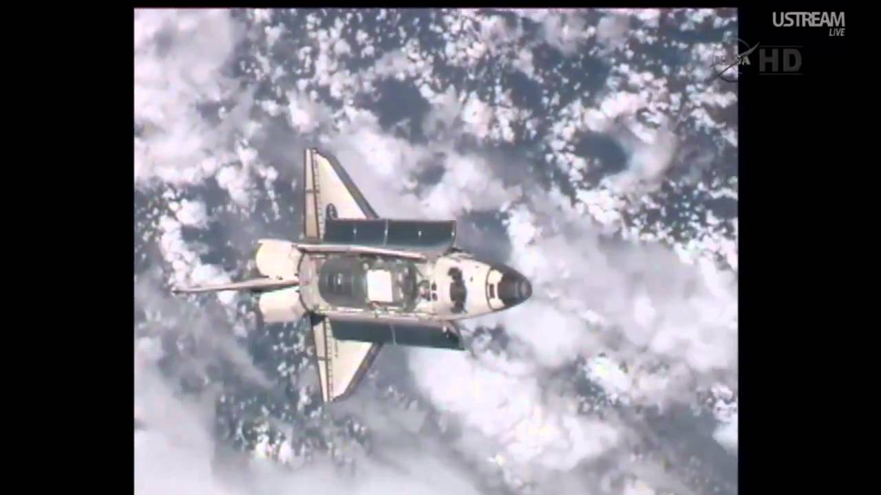 Space Shuttle Discovery/STS-133's final RPM(Rendezvous Pitch Maneuver ...