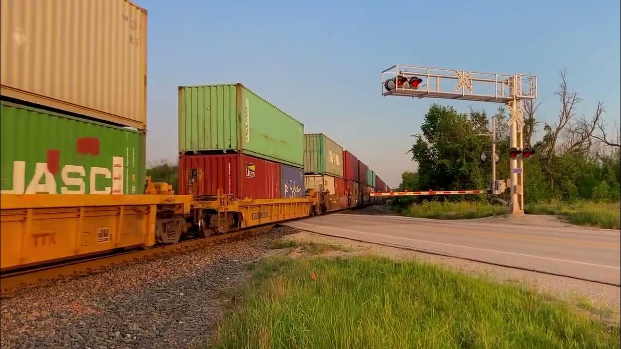 CN 3216 100th Anniversary (GE-ET44AC) & CN 2900 (GE-ES44AC) lead NB Intermodal @ MP 134 on (7/12 ...