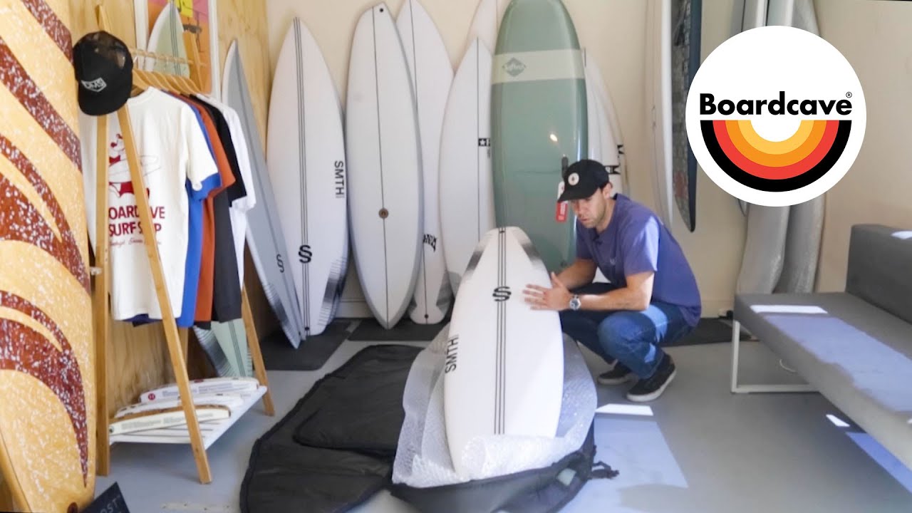 How to pack a surfboard bag - YouTube