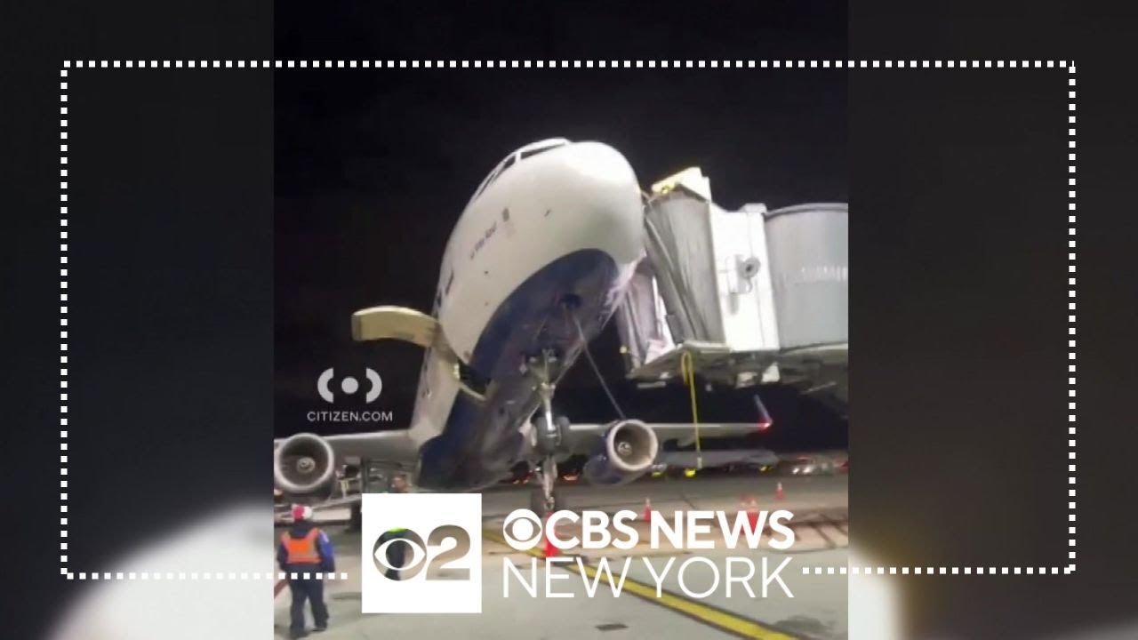 JetBlue plane tips backward as passengers get off at JFK - YouTube