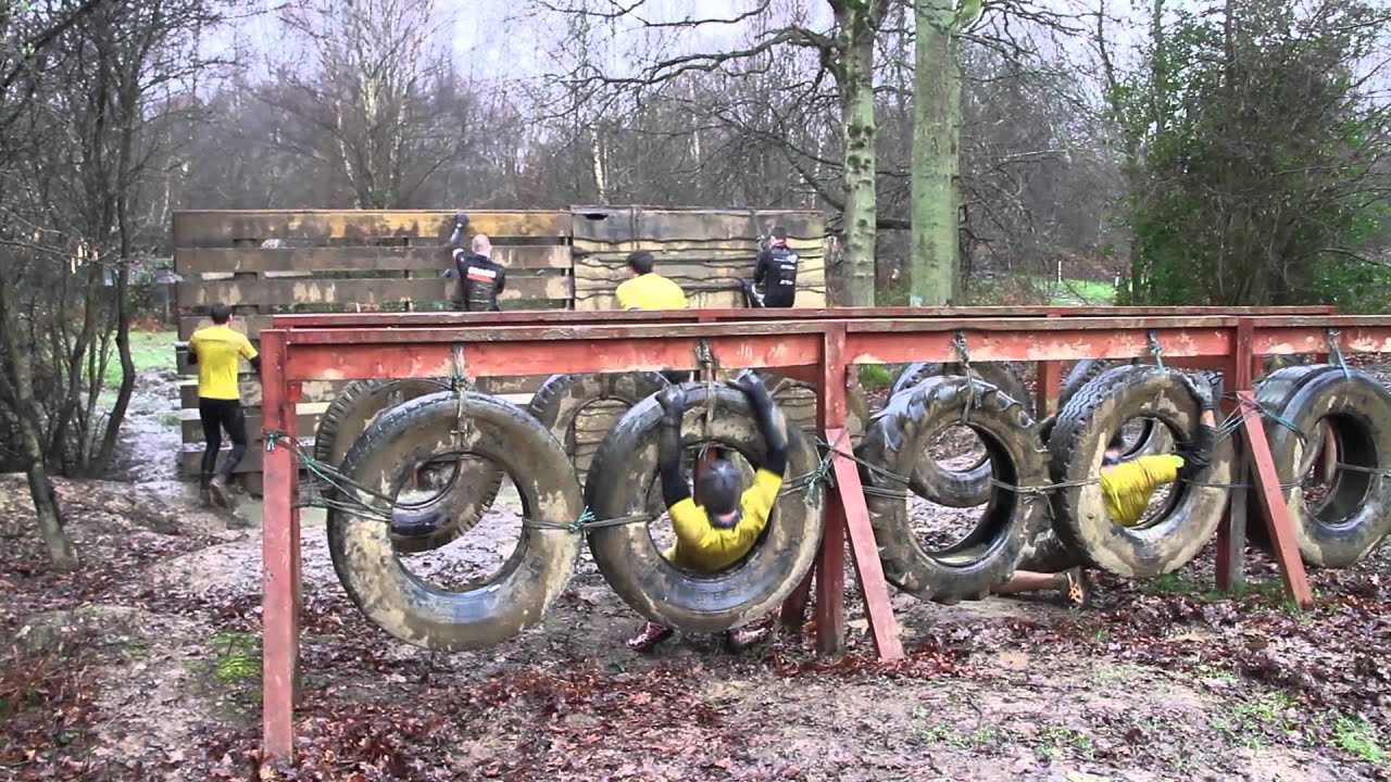 Tire Obstacle Course Man Crawling Through The Tire During Obstacle