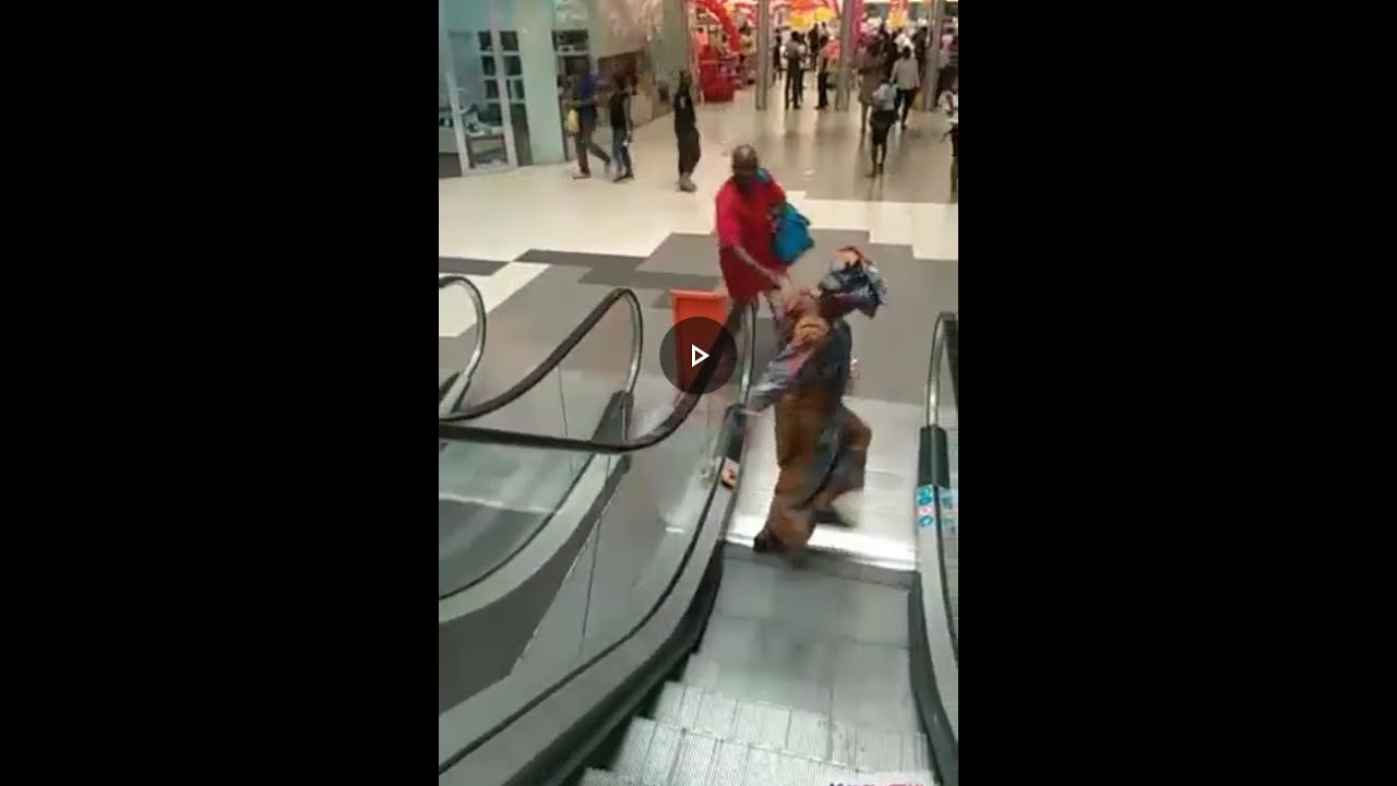 Woman Scared of Escalator in Lagos - YouTube