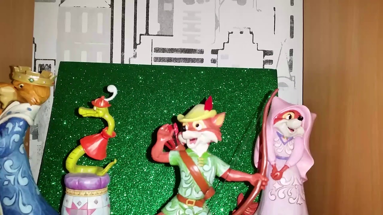 Jim Shore Disney Robin Hood figures on my book shelf - YouTube
