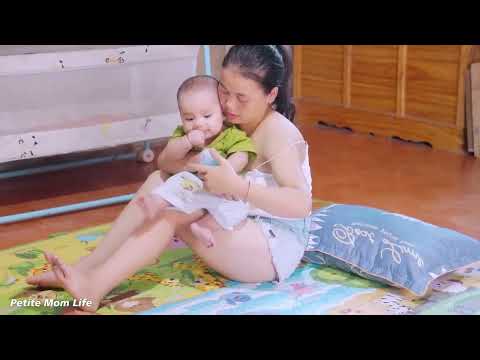 BREASTFEEDING BABY BY BEAUTIFUL MOTHER.