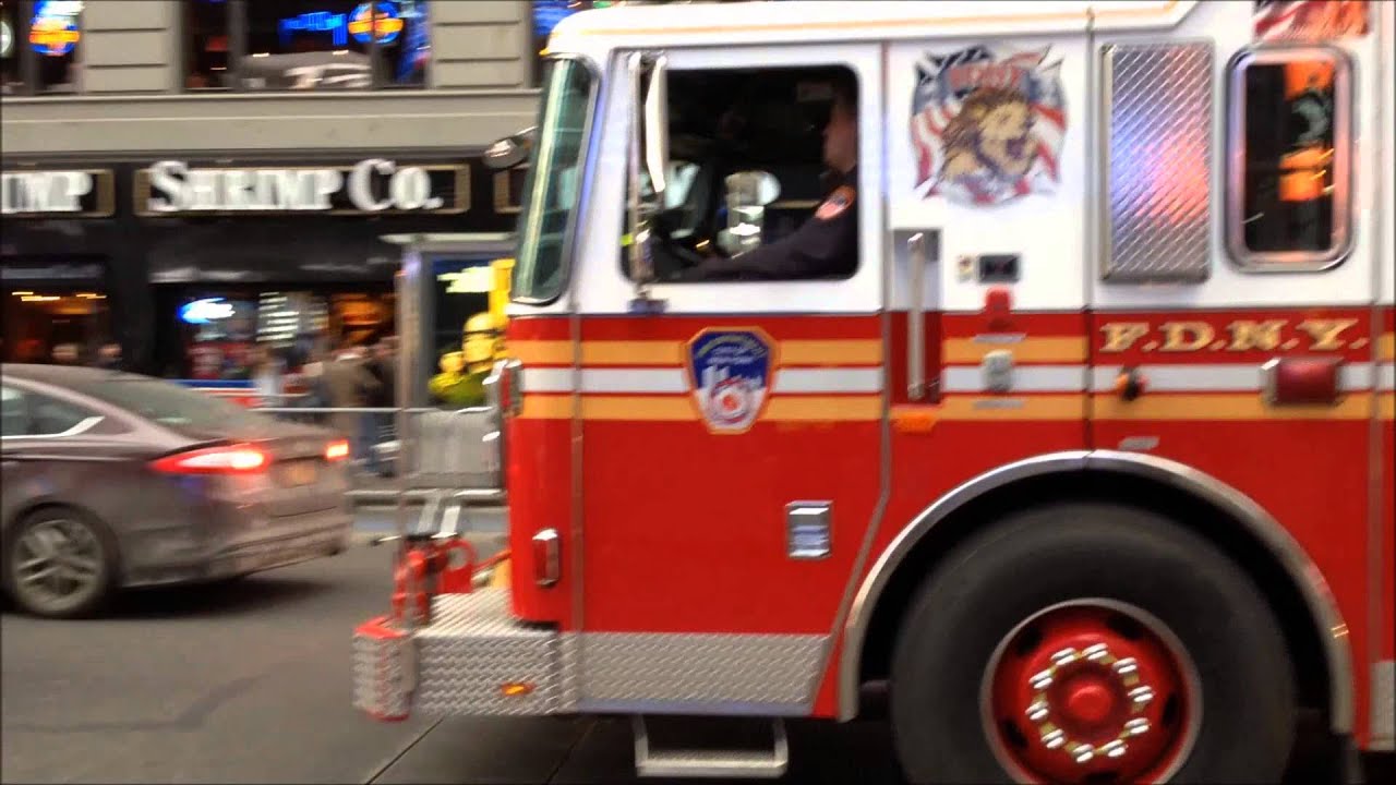 FDNY ENGINE 23 CRUISNG BY W. 44TH ST. IN THE TIMES SQUARE AREA OF ...