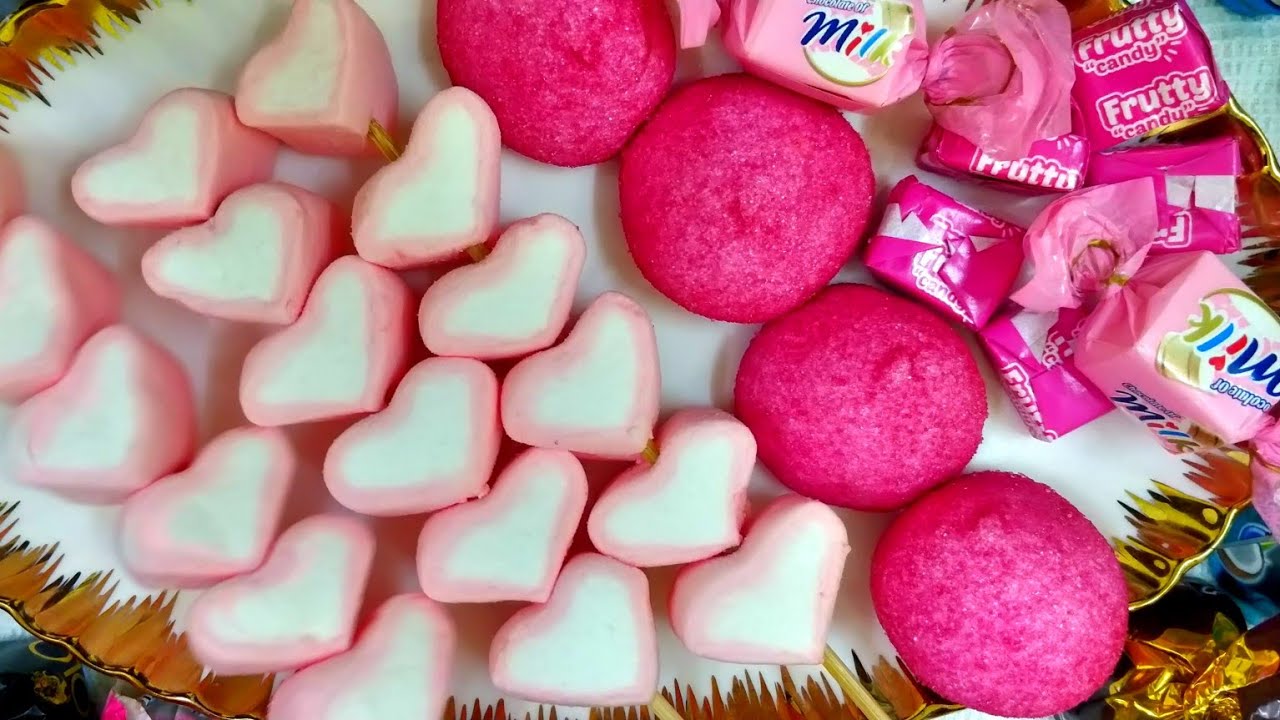 Filling the platter with pink candy # yummy heart marshmallow lolipop ...
