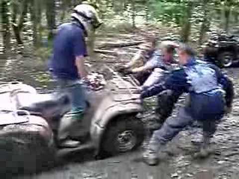 ATV stuck in mud - towed - YouTube