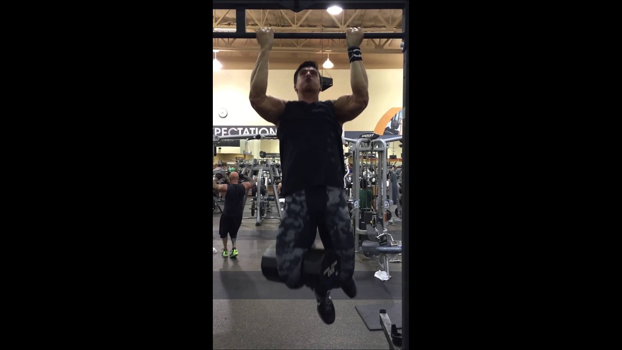 Superman Sanchez pull ups with 100 pound dumbbell - YouTube