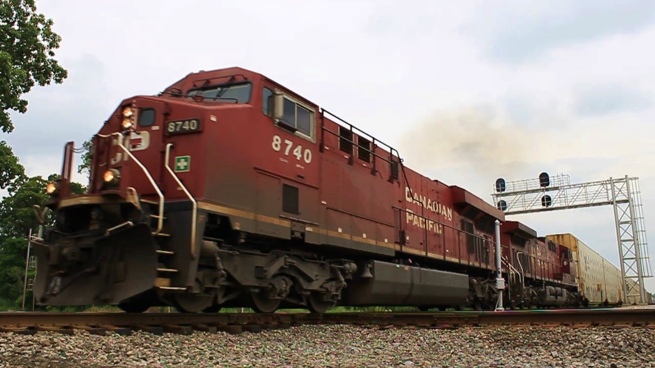 CP ES44AC & AC44CW slowly make their west as they hit the diamond w/ CP Manifest Train 241 - YouTube