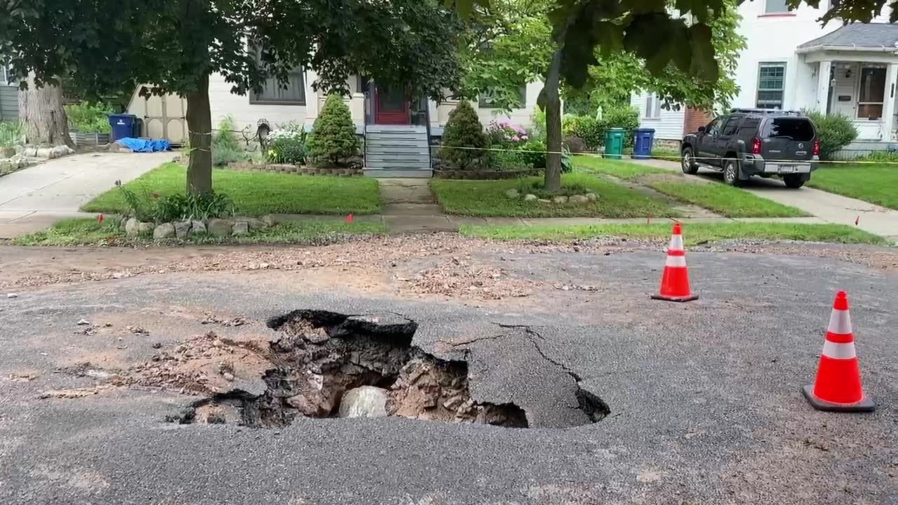 Watch: Water main break leads to sinkhole near Hertel - YouTube