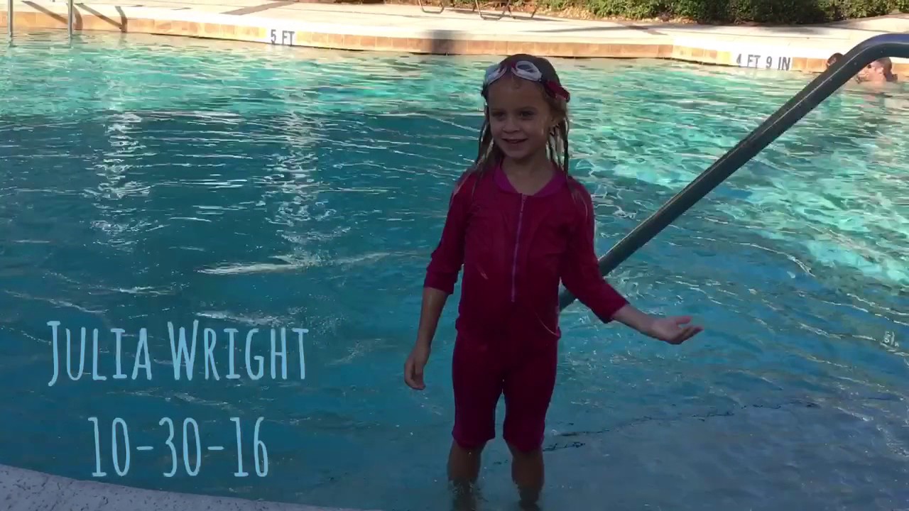 Julia doing her swim float swim across the pool - YouTube