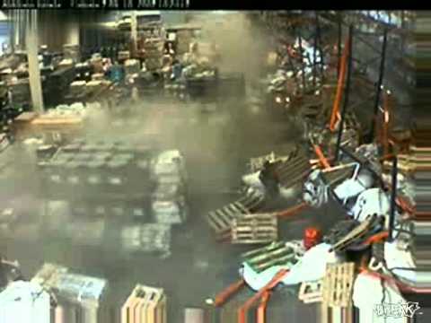 Factory Workers crashes forklift and takes out massive shelves. - YouTube
