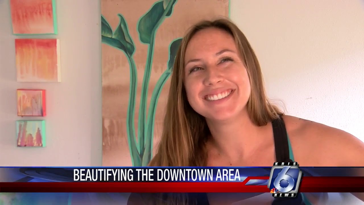 Artist sprucing up decrepit downtown storefronts - YouTube