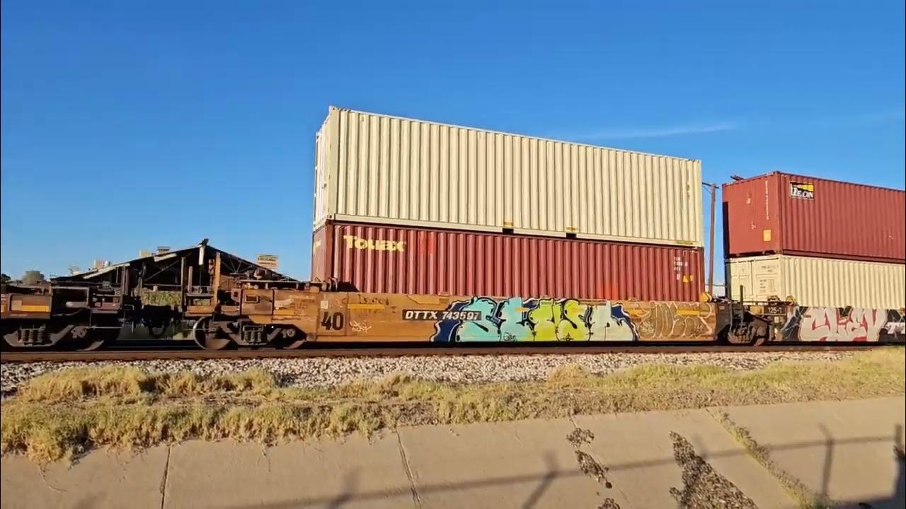 Union Pacific eastbound monster intermodal train with two mid-train DPU'S in central El Paso TX ...