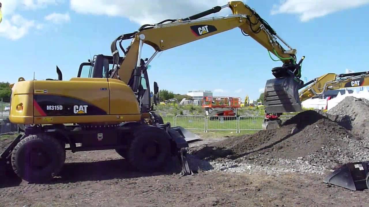 Cat M315D [MaskinExpo 2011] - YouTube
