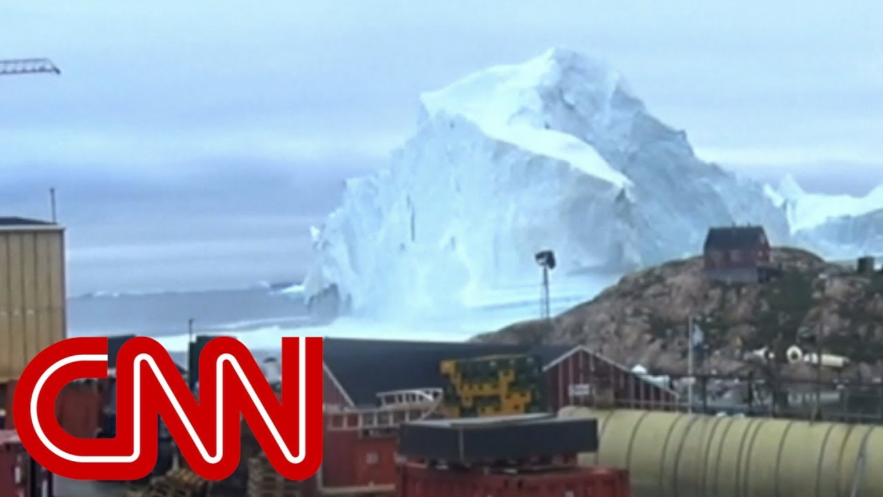 Massive iceberg threatens tiny village - YouTube
