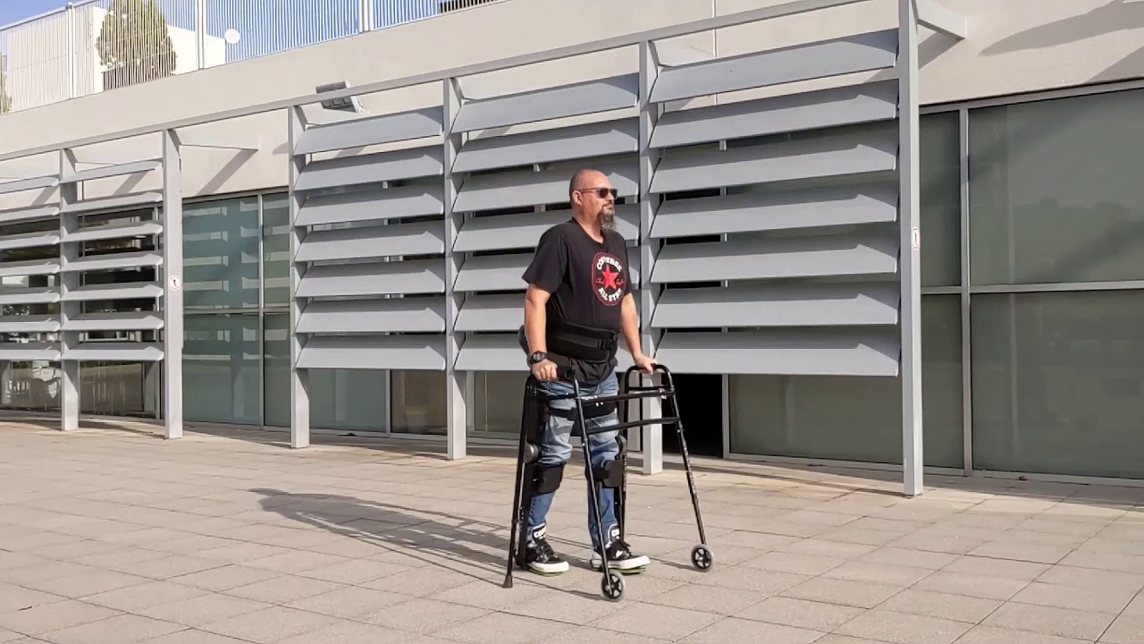 Paraplegic individual walking with the ABLE Exoskeleton - YouTube