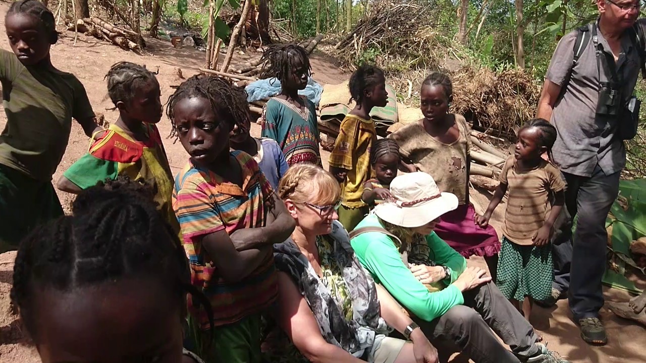 Grinding grain and a pottery demonstration at an Ari village, near ...