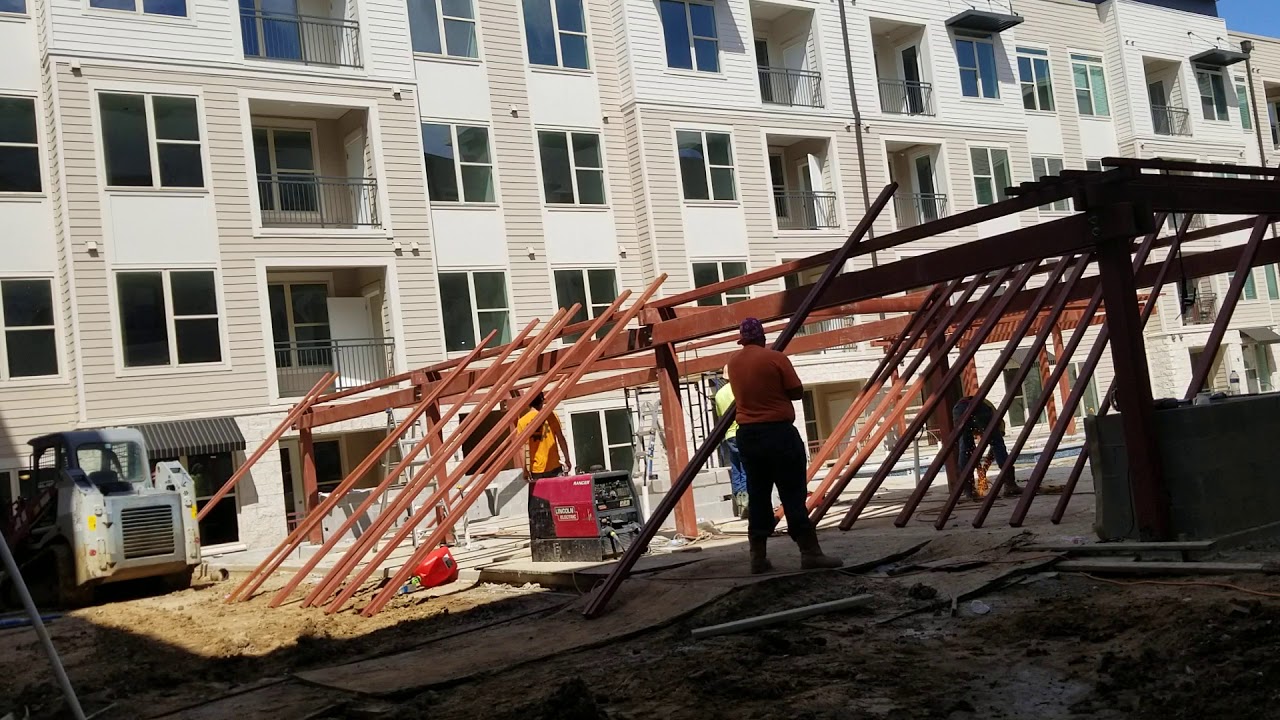 Timelapse building trellis for apt complex, new Construction - YouTube