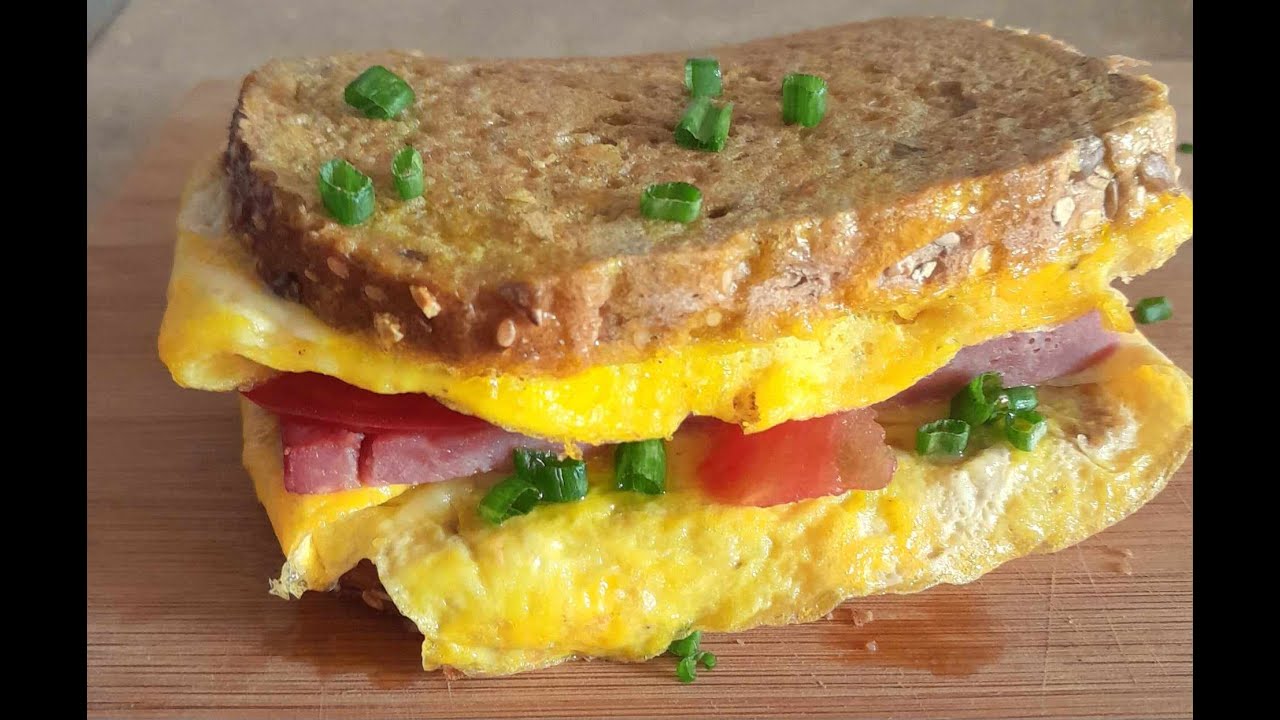 A delicious skillet breakfast. Slices with egg and ham. - YouTube
