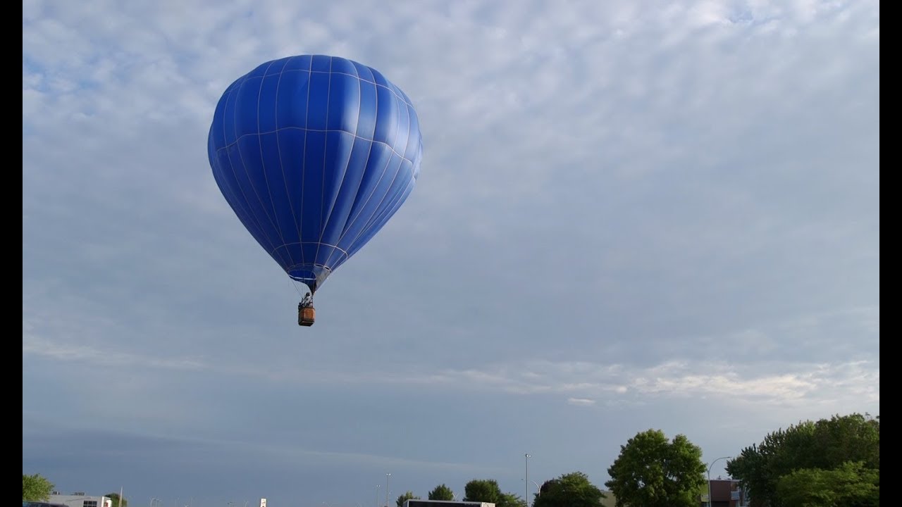 Balloon pilot navigates the breeze above Quebec. - YouTube