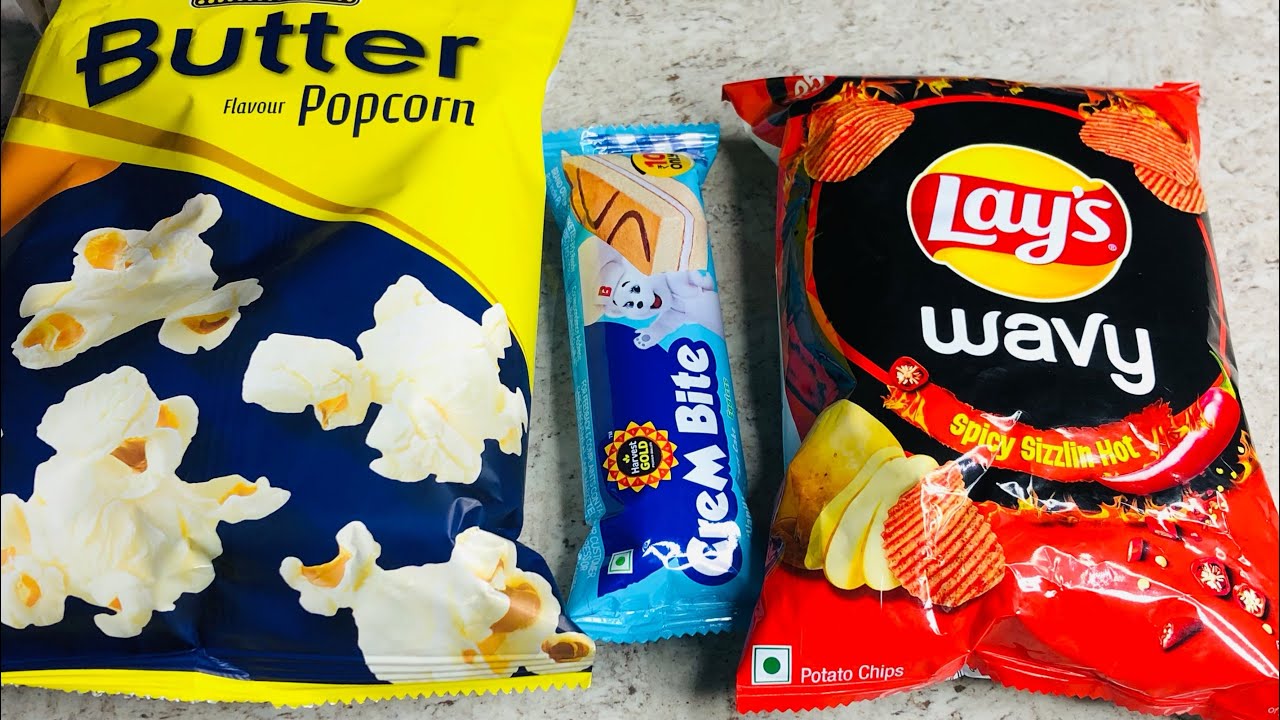 Lots of unique snacks, cakes, popcorn, chips, chocolates, lays, candies ...