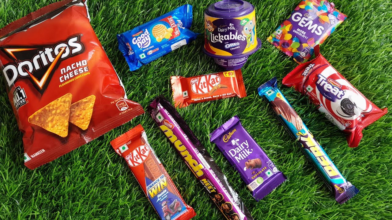 Unwrapping Doritos nacho cheese corn chips , Nestle KitKat and some ...