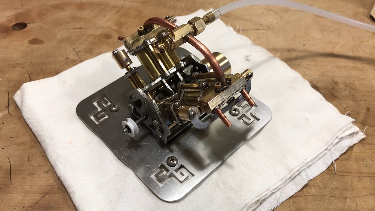 4 cylinders mini steam engine equipped with fly wheel - YouTube