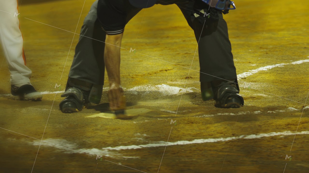 Slow motion of baseball umpire cleaning home plate - YouTube