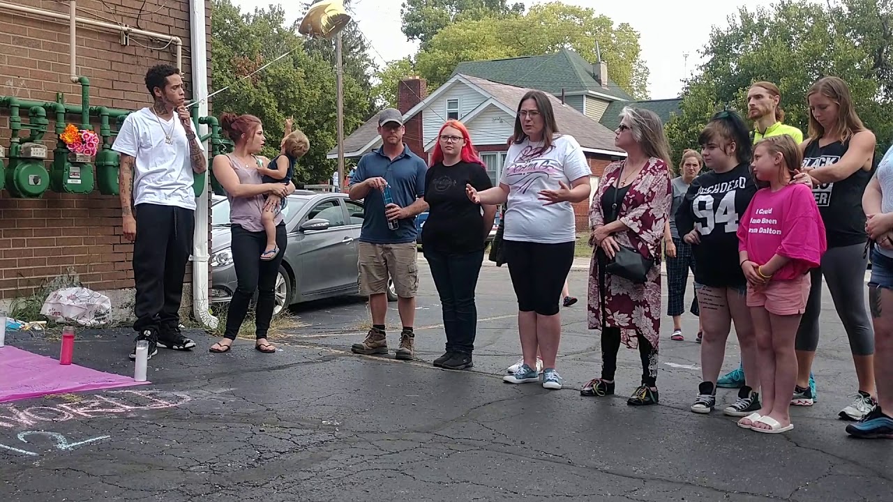 Bobbi McCalla leads a prayer Friday at the vigil for her late sister ...