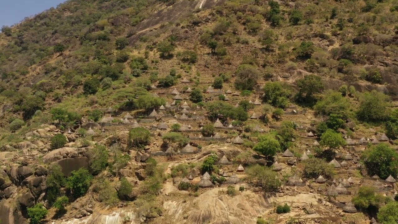 Aerial view of a Lotuko tribe village in the mountain, Central ...