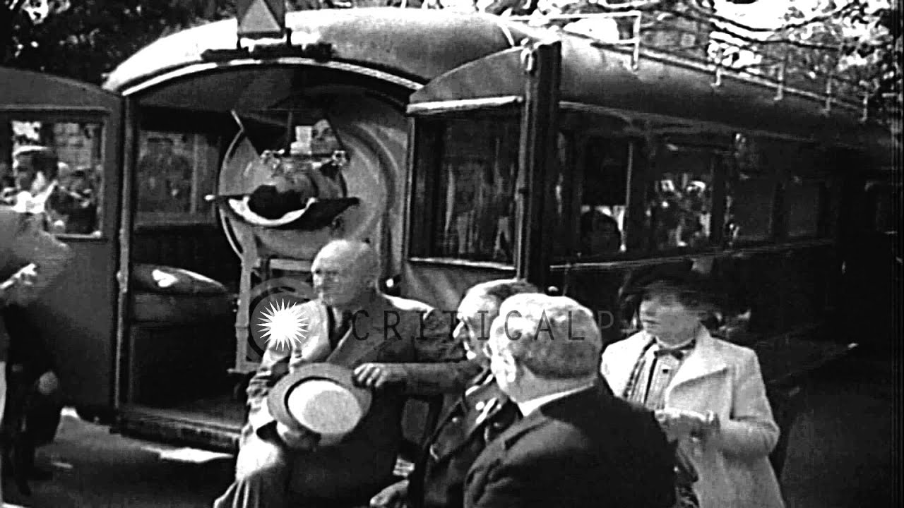 An infantile paralysis victim, Fred Snite, arrives in his mechanical ...