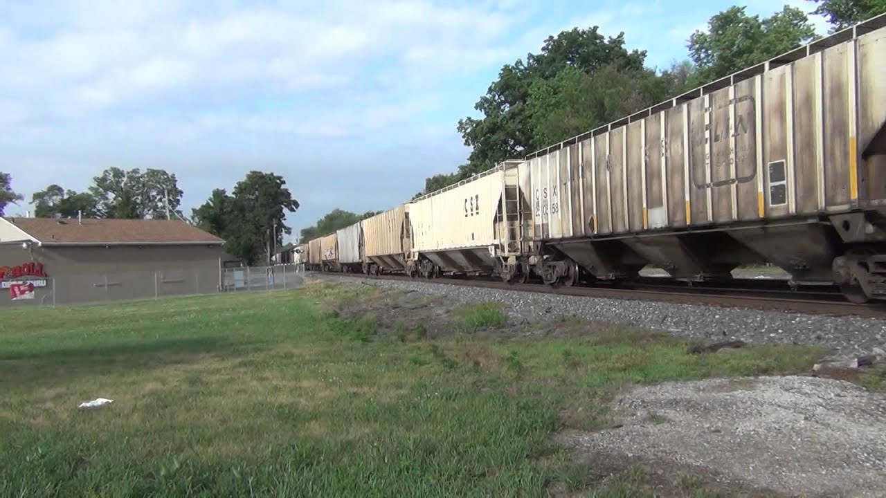 CSX #3155, 8643, 8094 leads hopper train South on Dayton's West side ...
