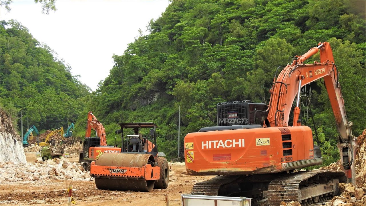 Hitachi Excavators Trucks And Buldozer Working On The New Road ...