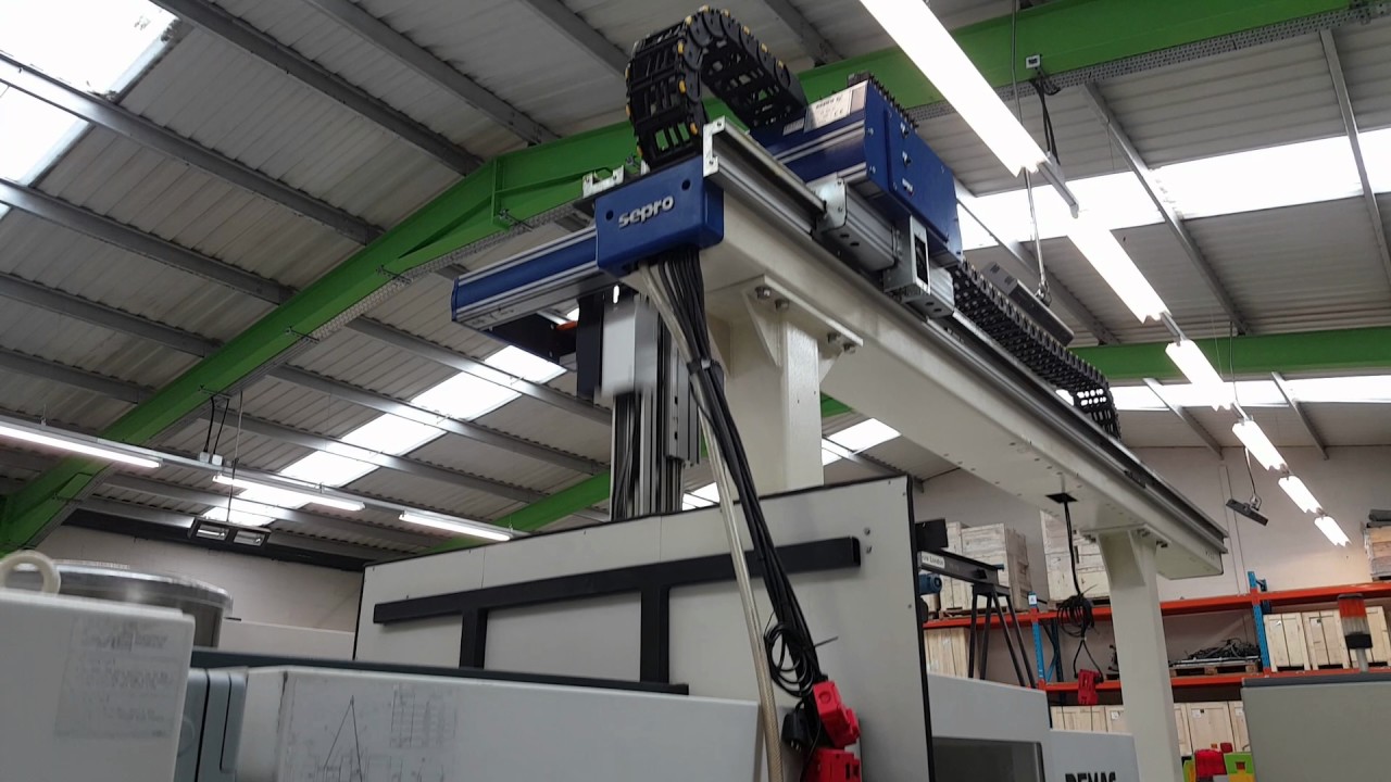Demag 100T with Sepro robot refurbished by STV Machinery - YouTube