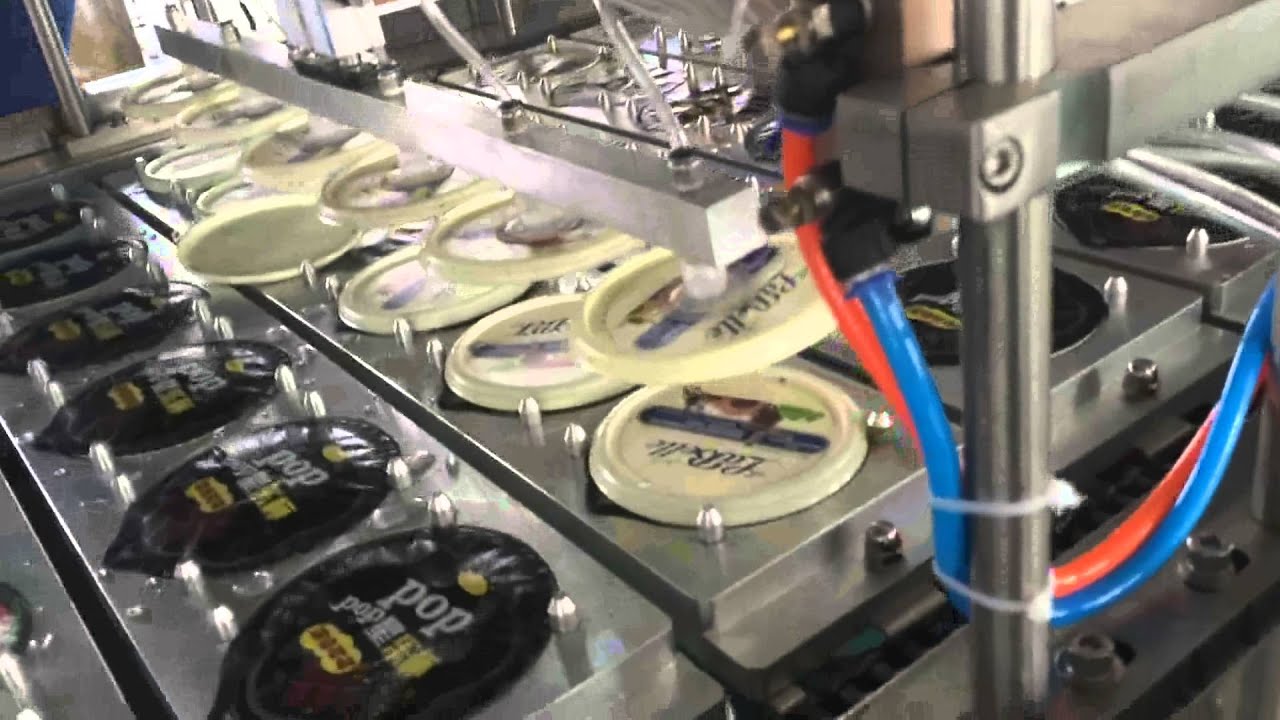 Automatic hummus filling and sealing machine - YouTube