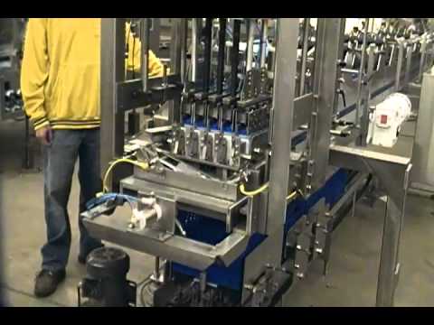 Dairy Case Packer with Soft-Set Packing Head Assembly by Hamrick - YouTube