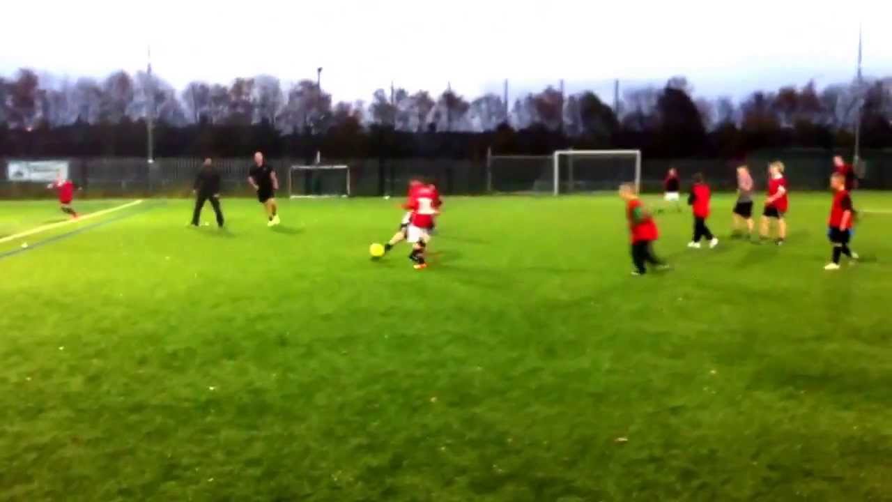 Most players on the pitch. Disorganised football chaos. Walker juniors ...