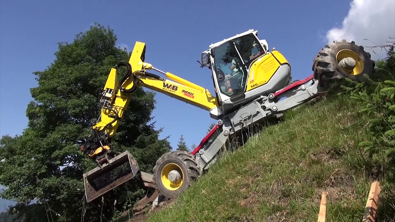 Menzi Muck M545x beim Hinterfüllen & Planieren - Backfilling & Grading ...