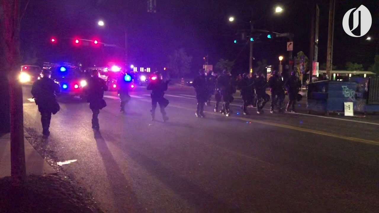 Police officers rush crowd during Portland protest police declared a ...