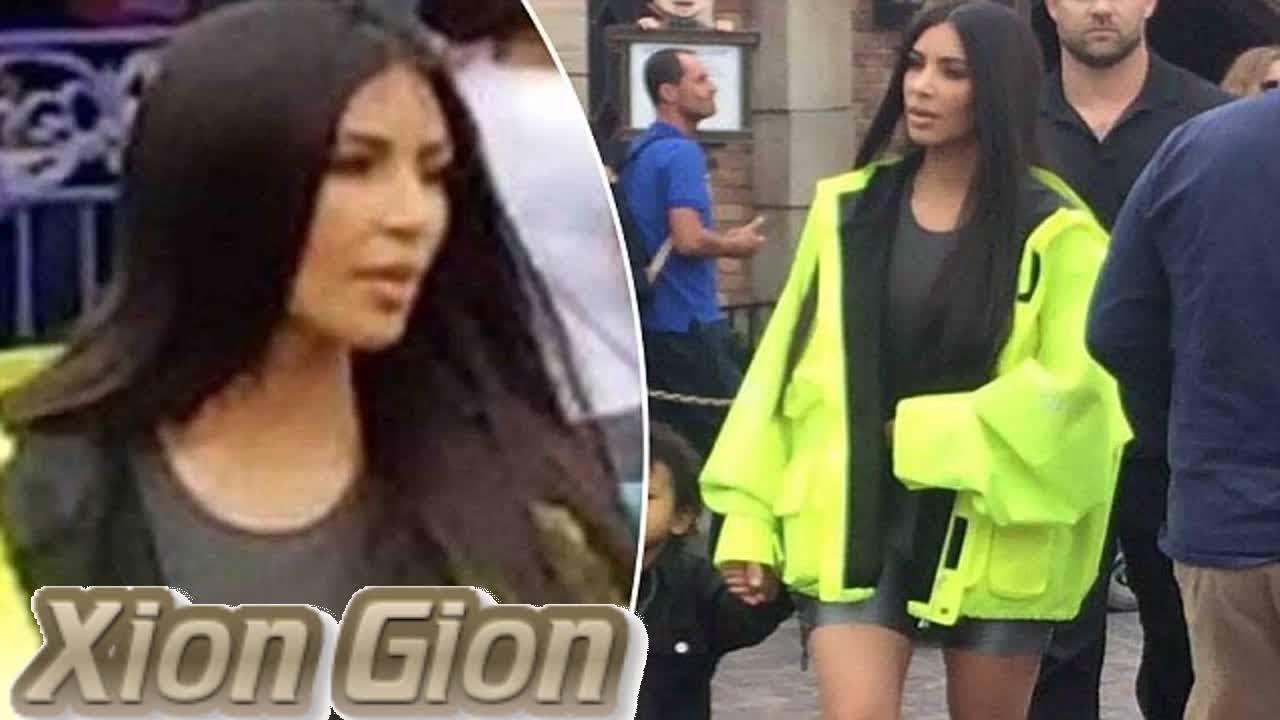 Kim Kardashian wears neon yellow jacket to Disneyland with the kids ...