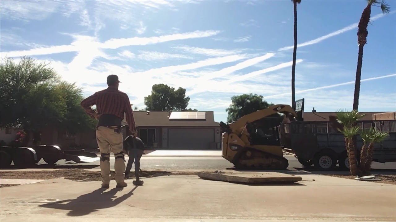 Concrete Driveway Removal Using A SkidSteer - YouTube