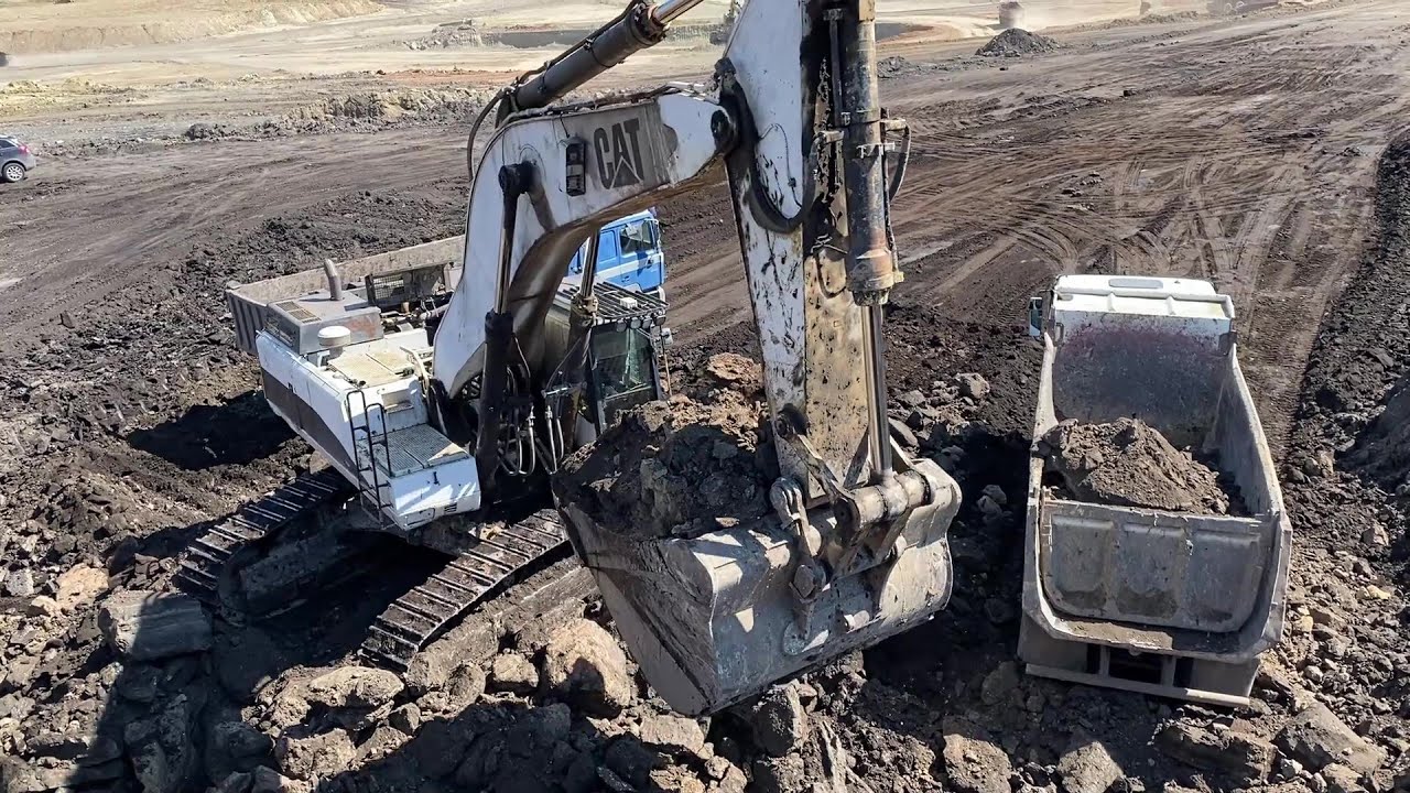 Caterpillar 375 Excavator Loading Mercedes And MAN Trucks - YouTube