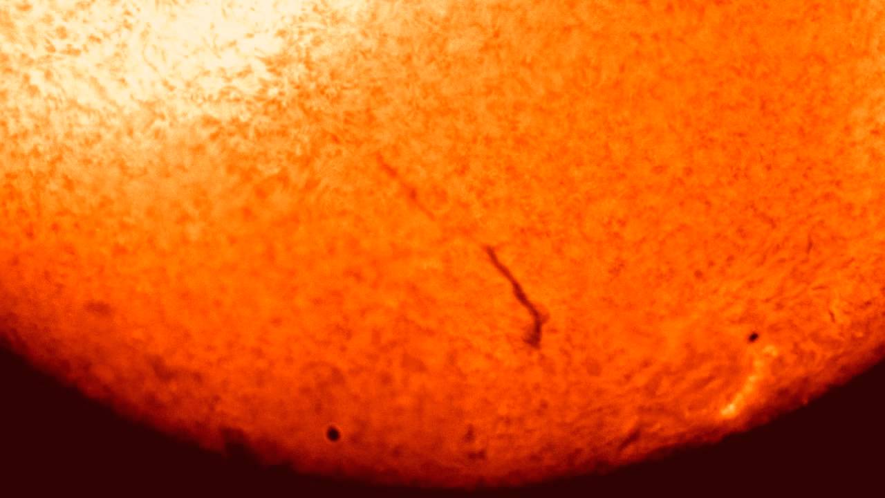 Very short film of a passenger plane view of the hydrogen alpha solar ...