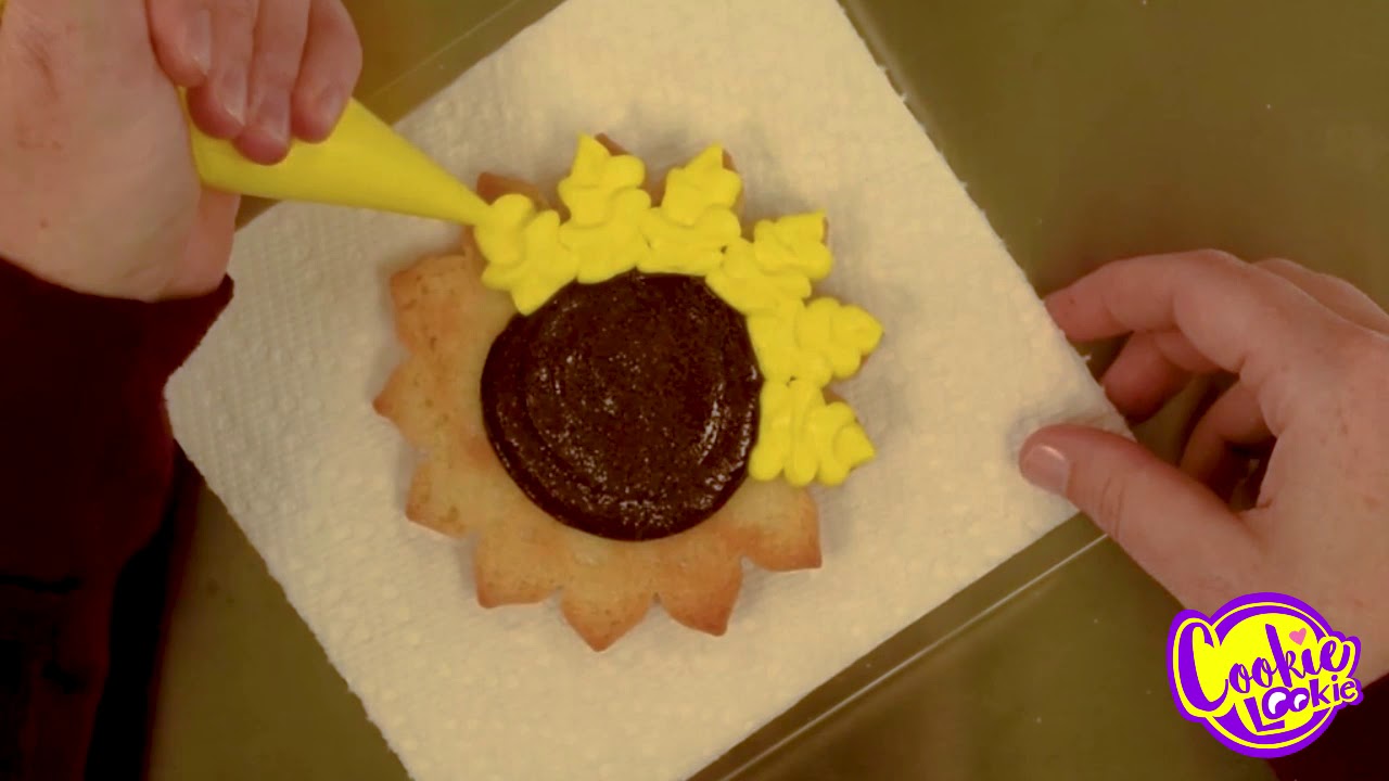 Decorating a royal icing cookie into a Sunflower - YouTube