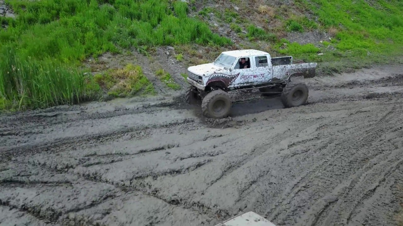trucks driving through mud - YouTube